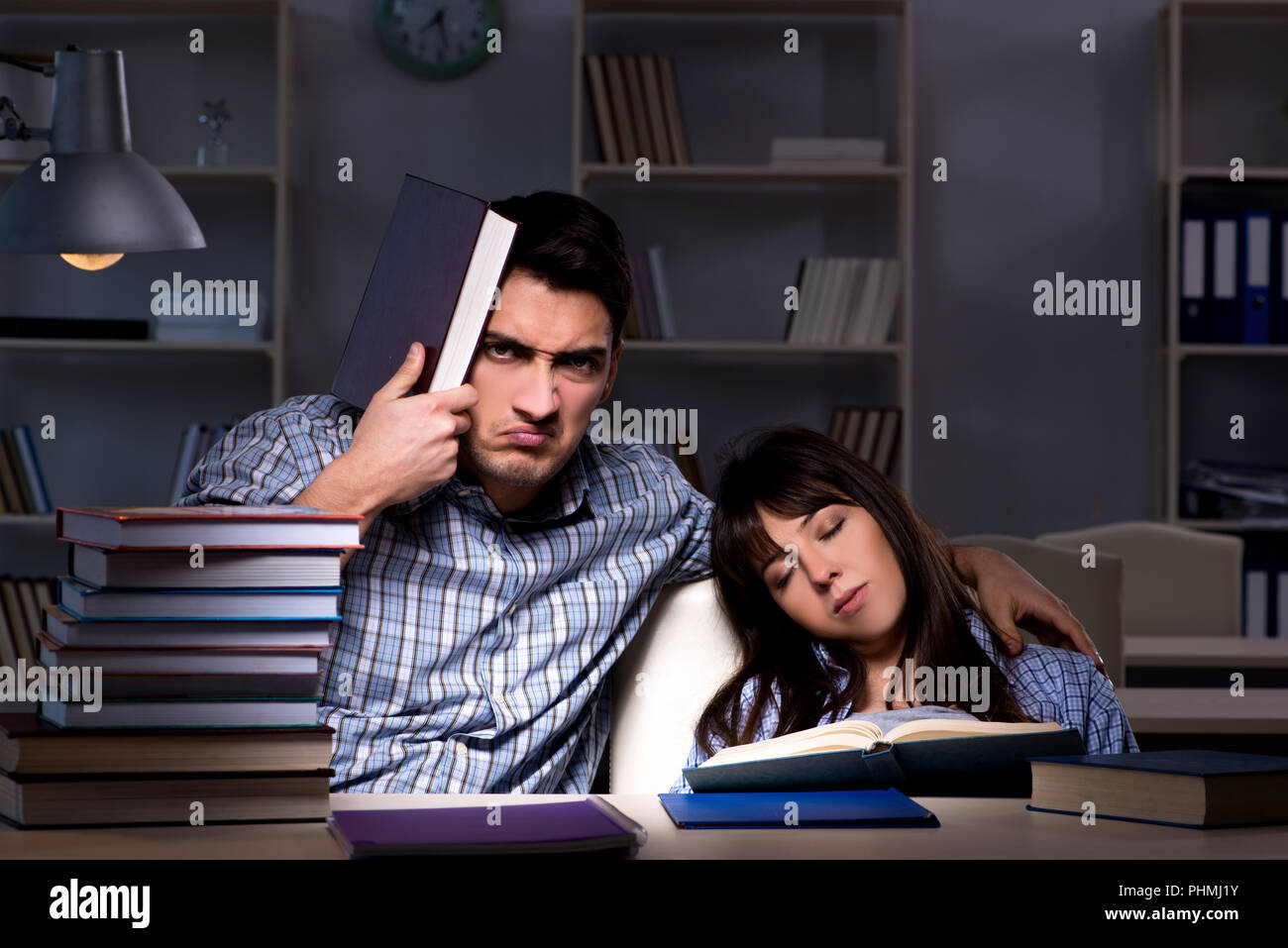 Two students studying late at night Stock Photo - Alamy