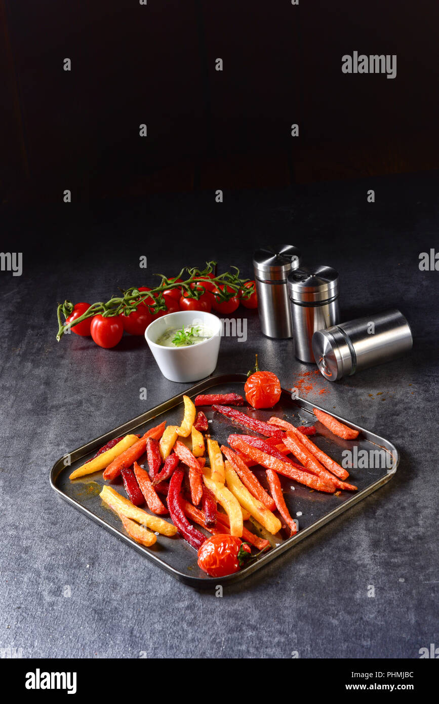 Colorful vegetable fries from the oven Stock Photo - Alamy