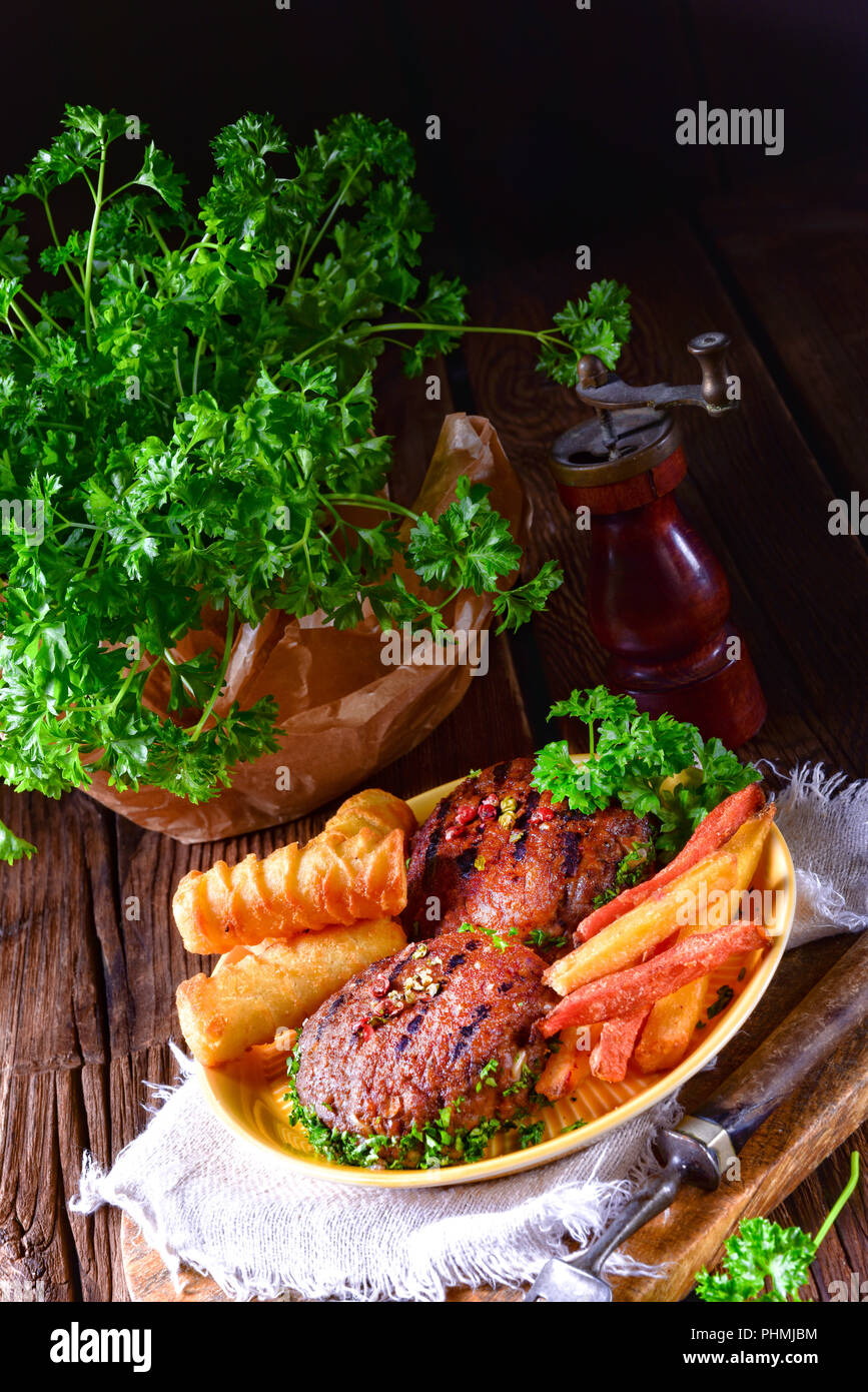 Grilled bullets with croquettes and vegetables Stock Photo - Alamy