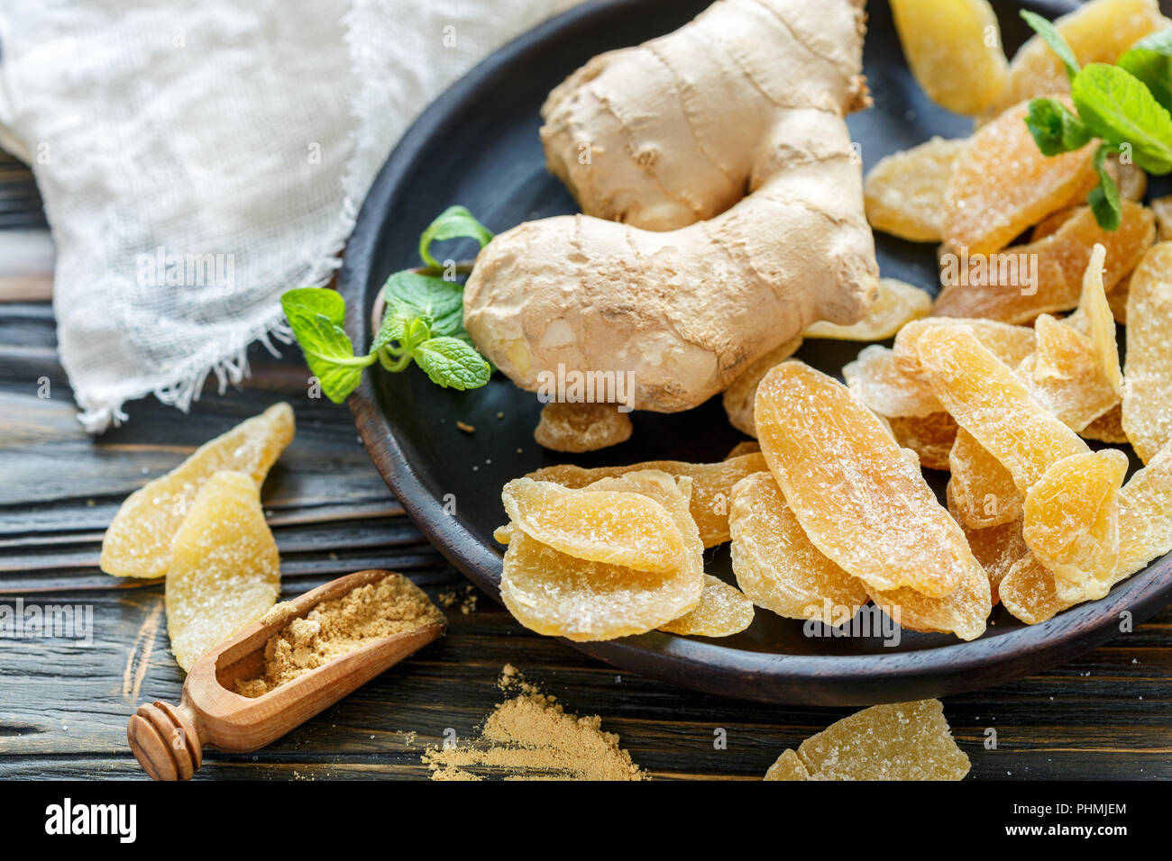 Root and ground ginger, spicy ginger candied fruit Stock Photo - Alamy