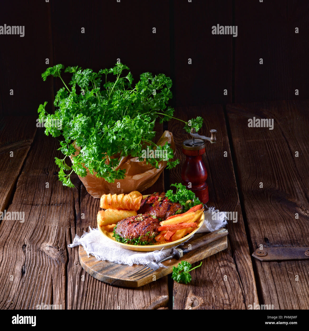 Grilled bullets with croquettes and vegetables Stock Photo - Alamy