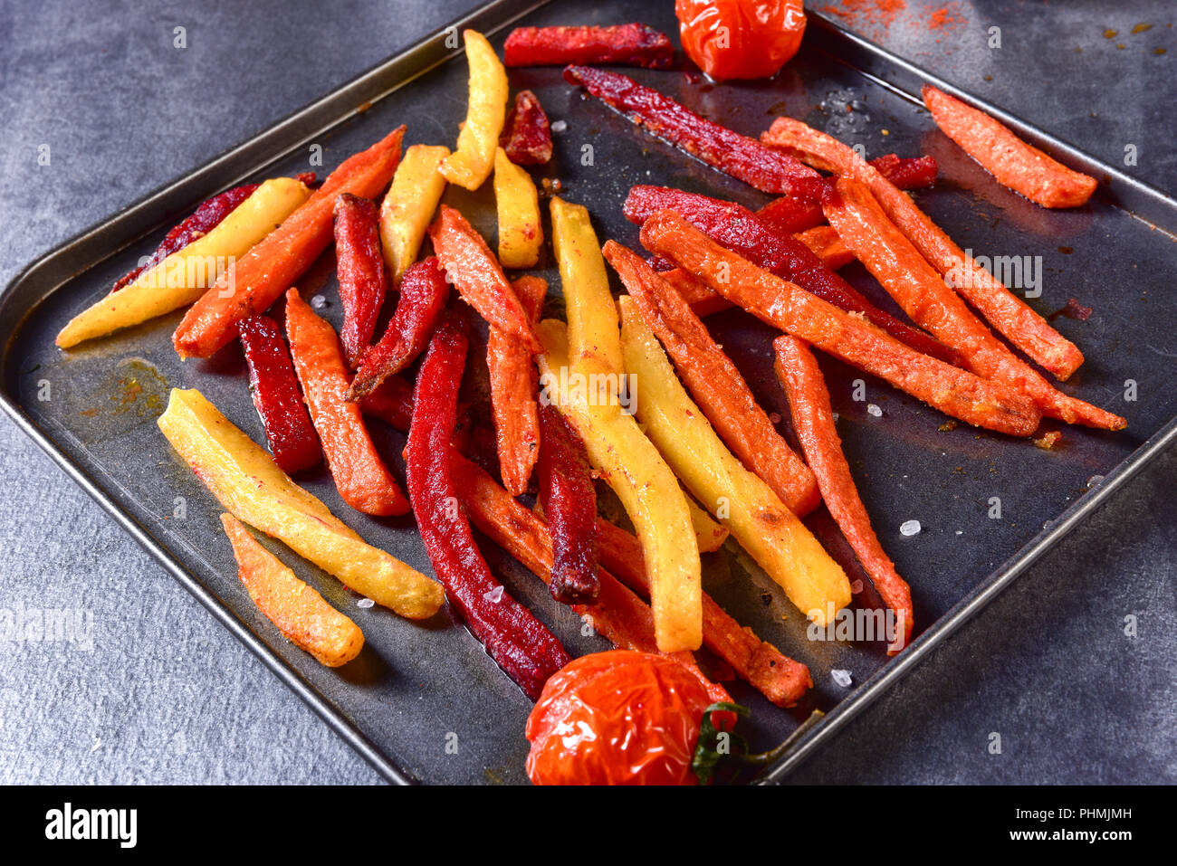 Colorful vegetable fries from the oven Stock Photo - Alamy