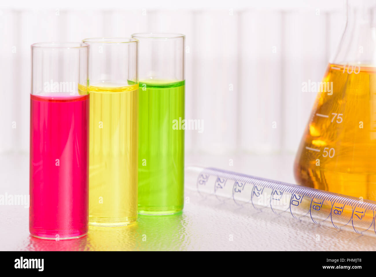 Scientific experiment in chemistry laboratory with liquid in test tubes ...