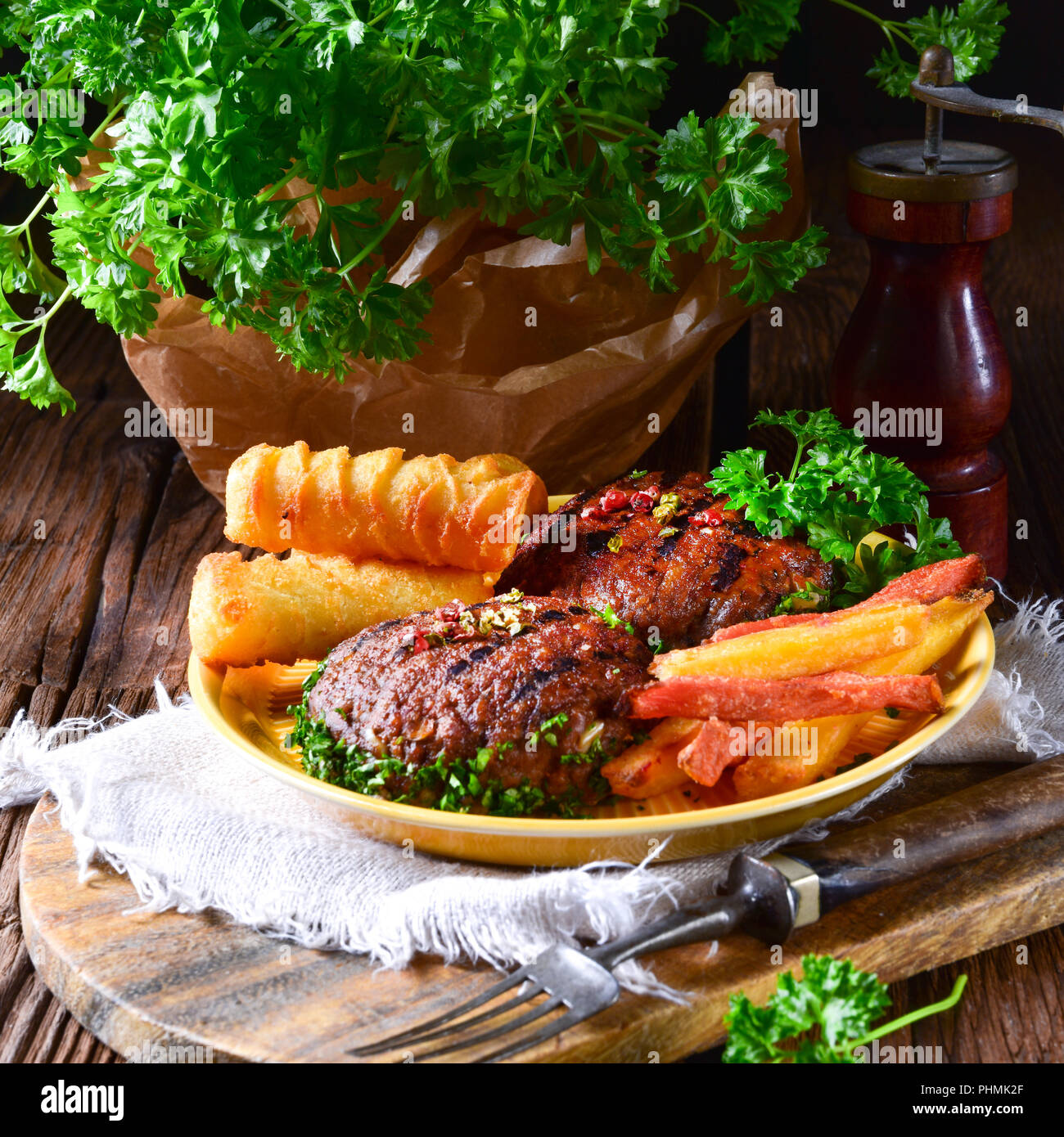 grilled bullets with croquettes and vegetables Stock Photo - Alamy