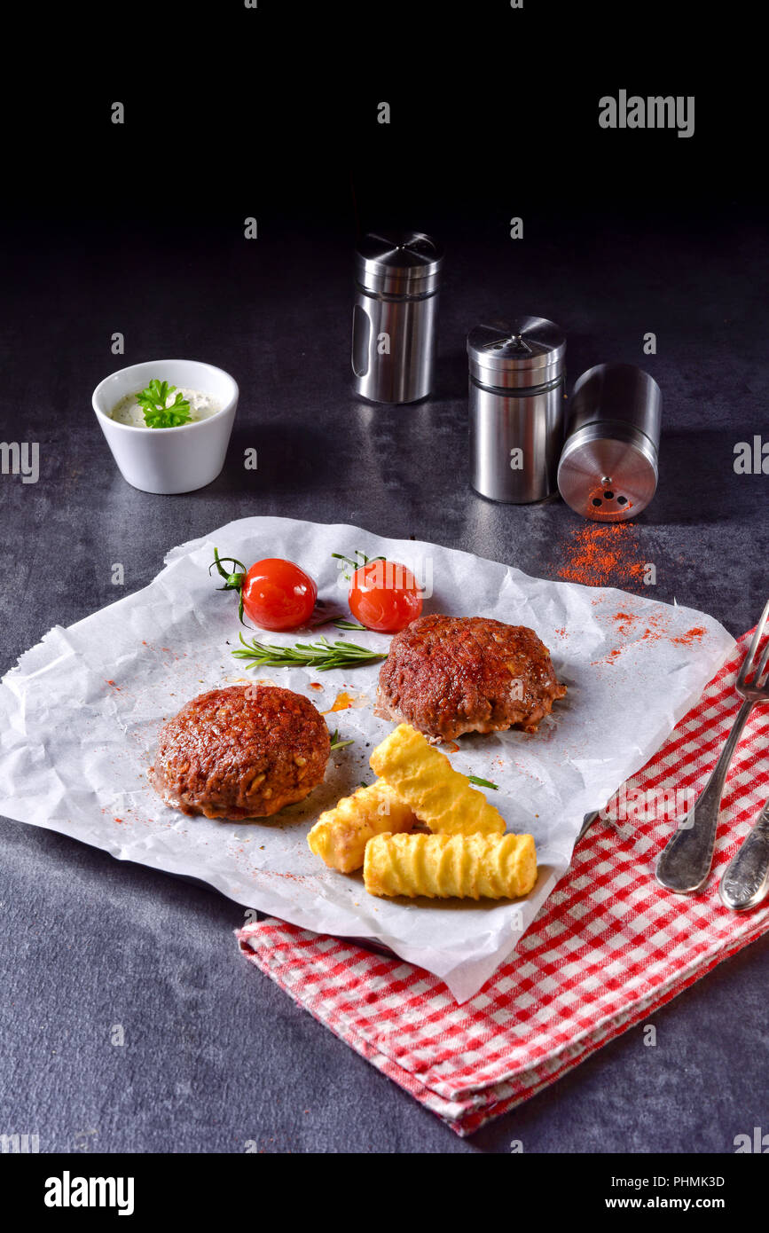 vegetable French fries with herb quark and tomatoes Stock Photo - Alamy