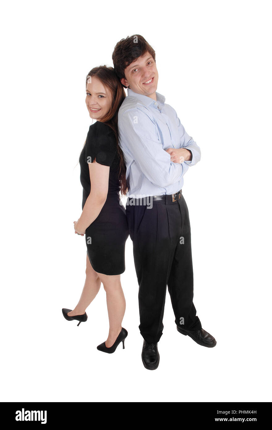 Lovely couple standing back to back Stock Photo - Alamy