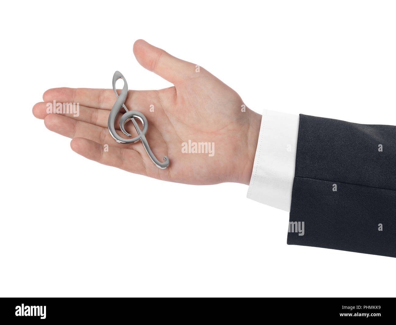 Hand holding a treble clef Stock Photo - Alamy