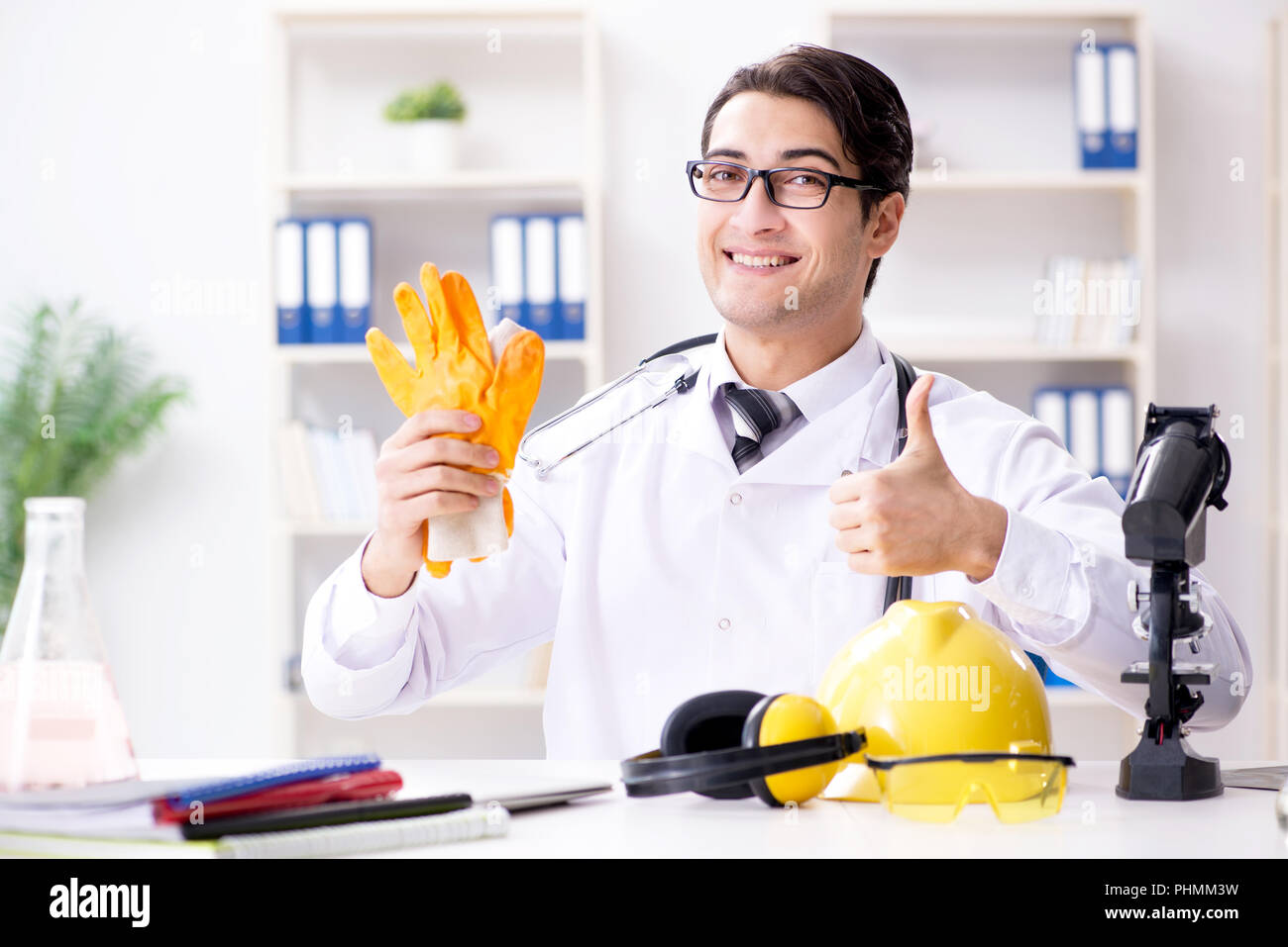 Doctor wearing protecting gloves hi-res stock photography and images ...