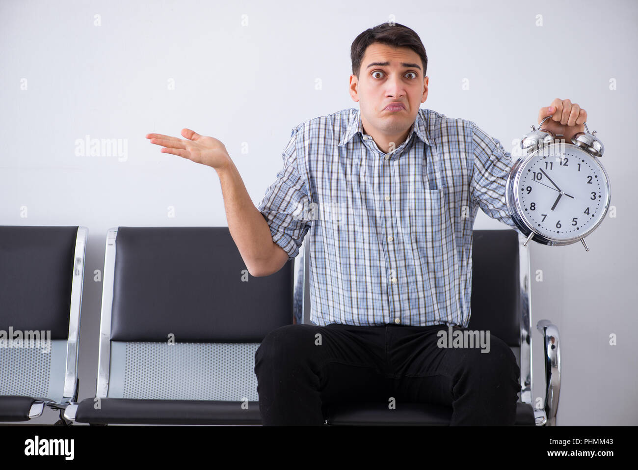 Man nervously impatiently waiting in the lobby Stock Photo - Alamy
