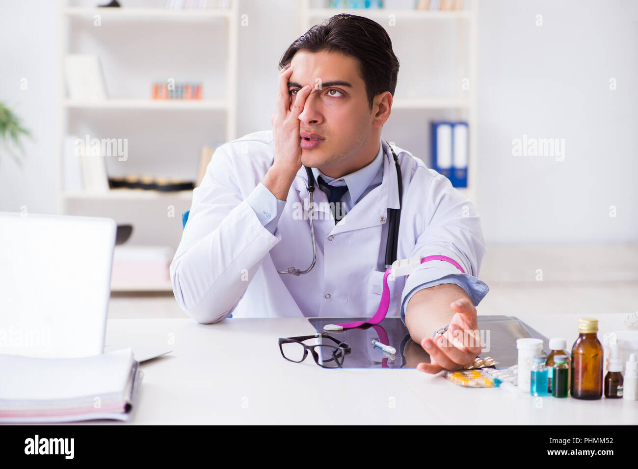 Doctor drug addict in the hospital Stock Photo - Alamy