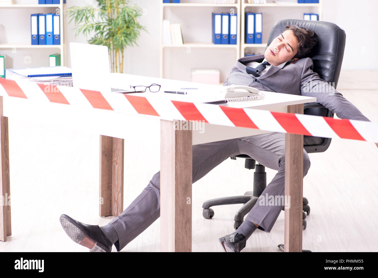 Dead businessman at this desk Stock Photo - Alamy