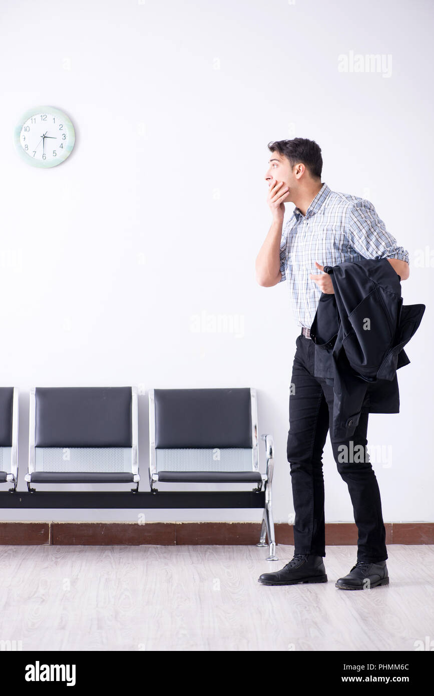Man nervously impatiently waiting in the lobby Stock Photo - Alamy
