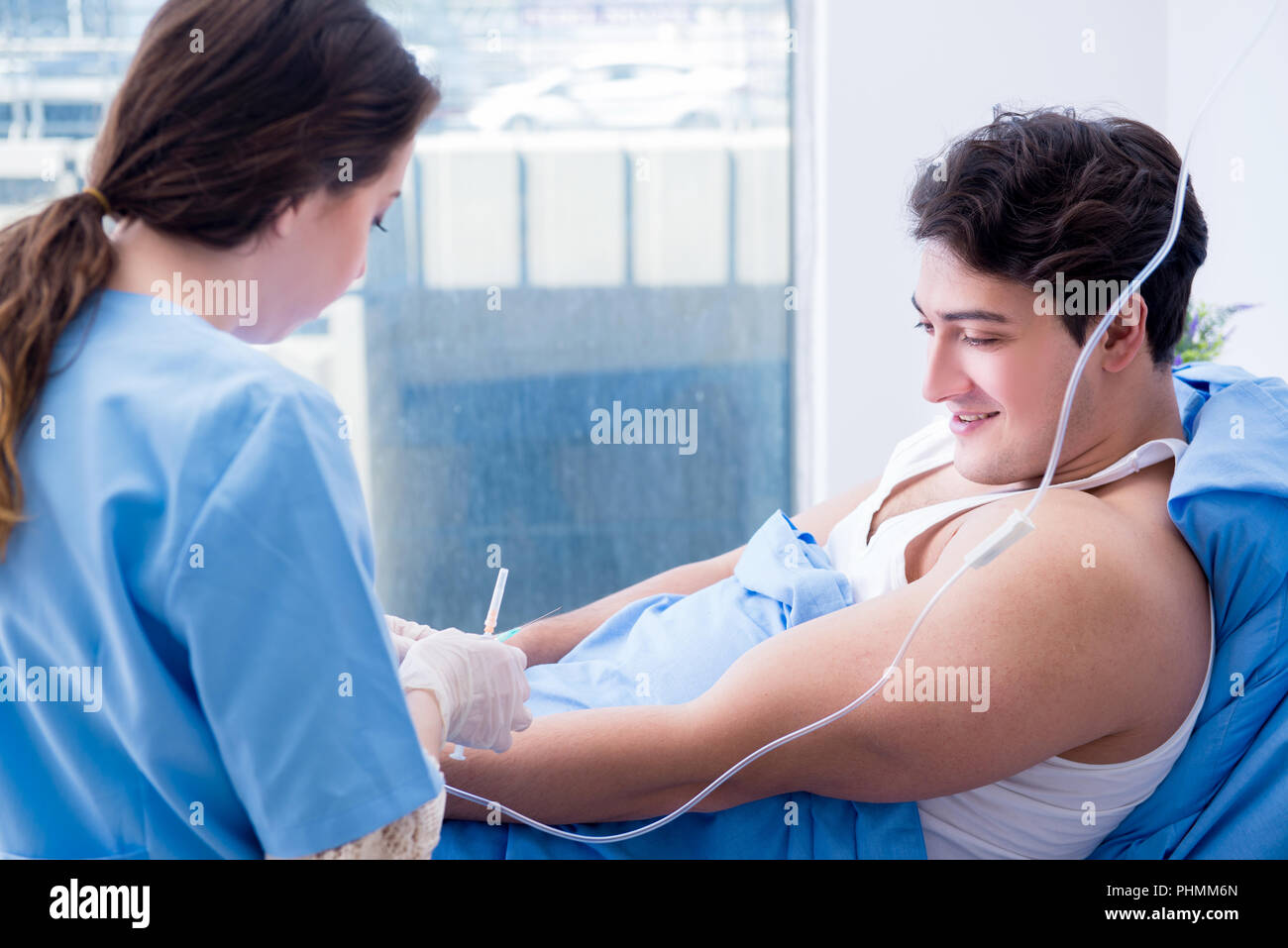 Doctor doing medical injection in hospital room Stock Photo - Alamy