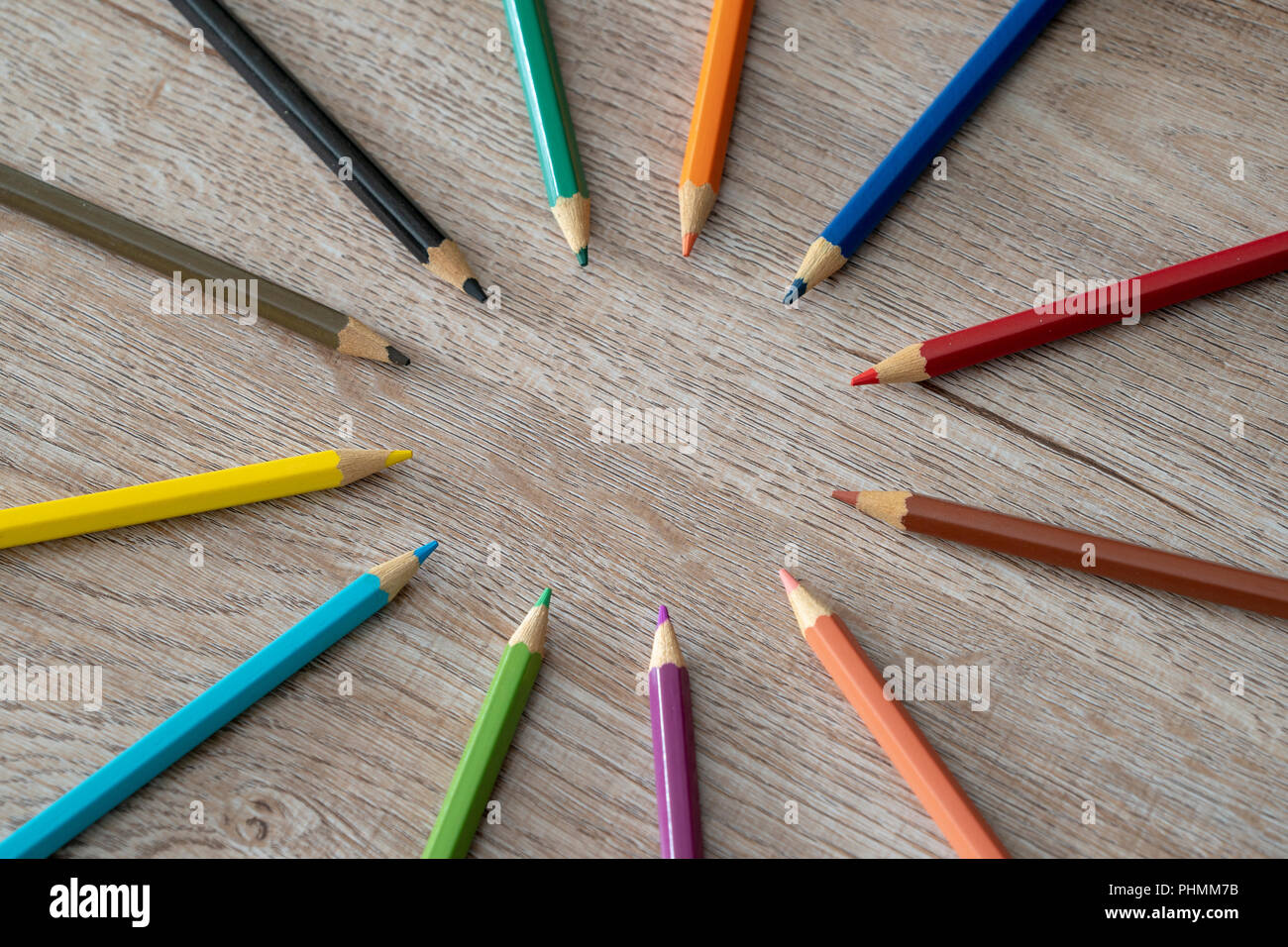 color pencils on a wooden floor // still life Stock Photo - Alamy