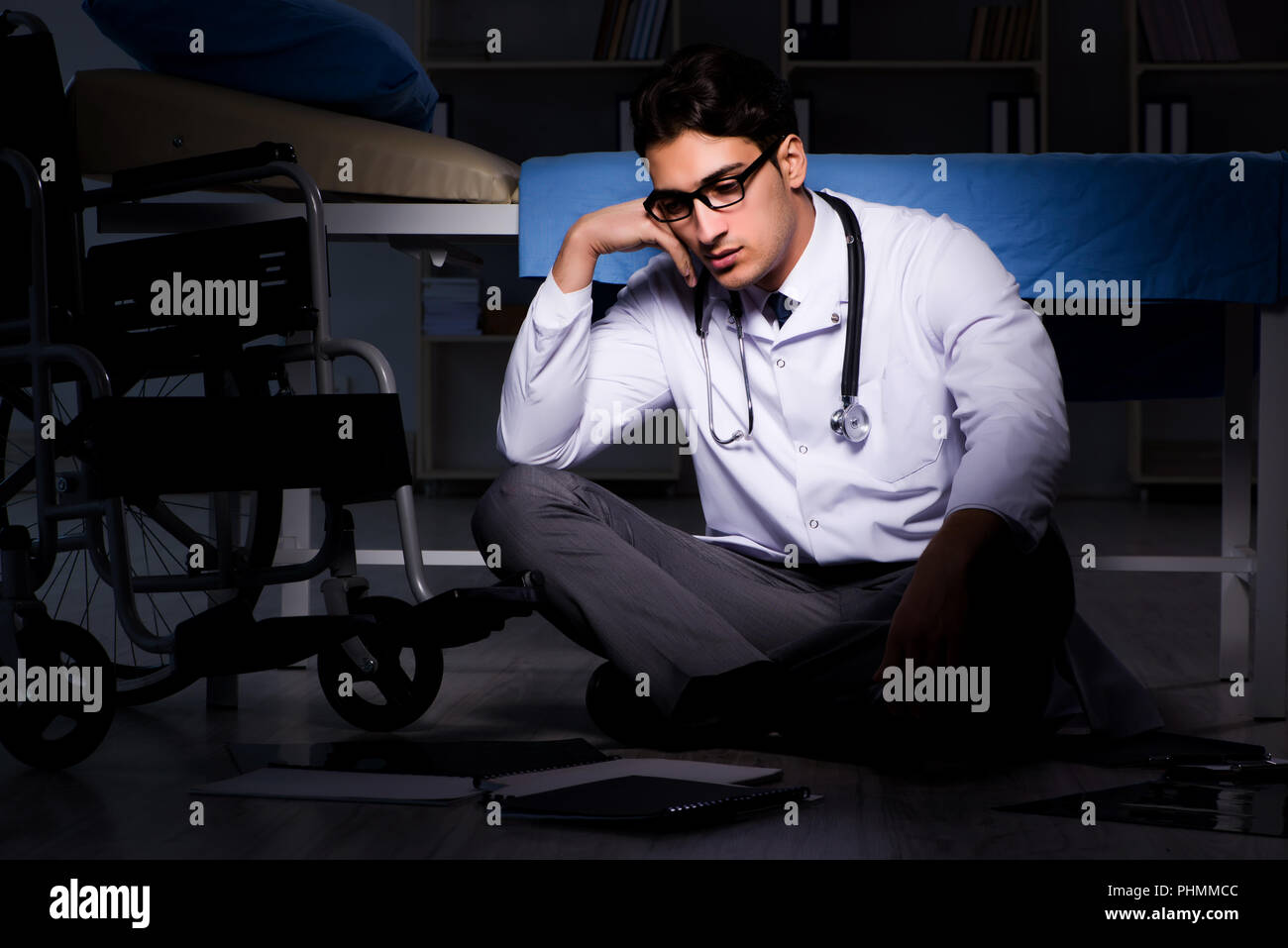 Doctor working night shift in hospital after long hours Stock Photo - Alamy