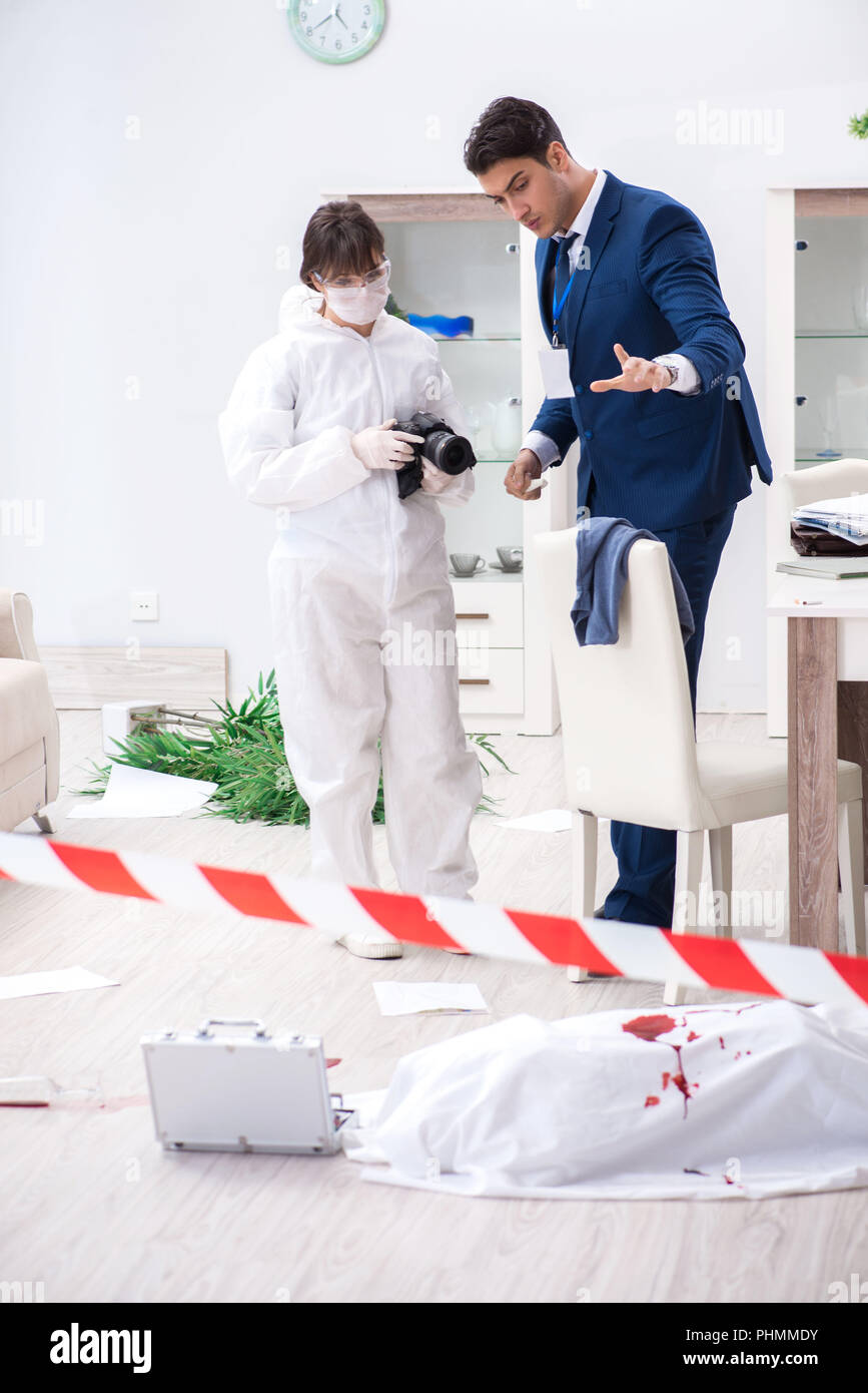 Forensics investigator at the scene of office crime Stock Photo - Alamy