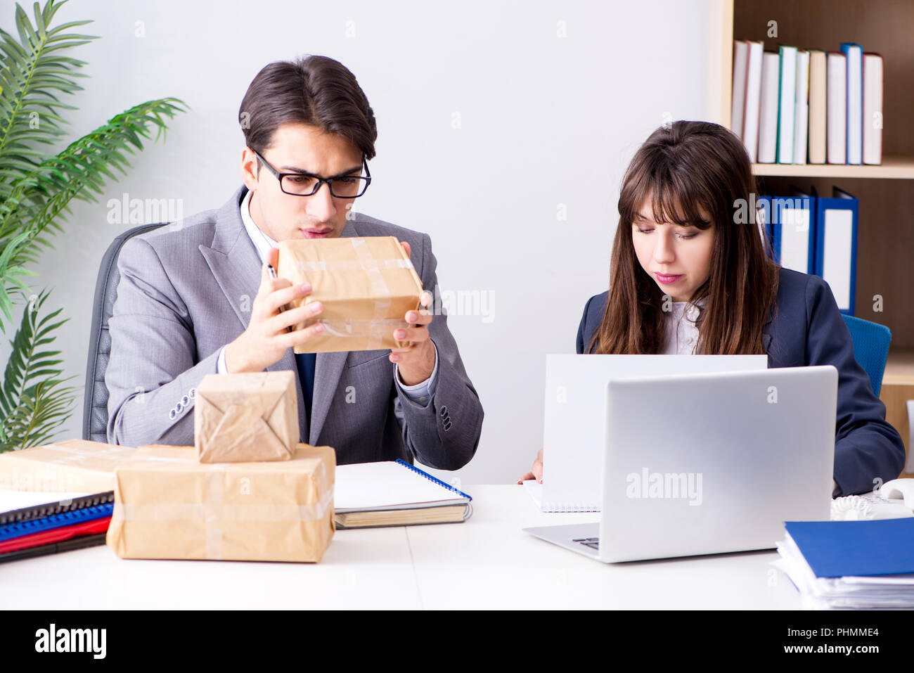 Business people receiving new mail and parcels Stock Photo - Alamy