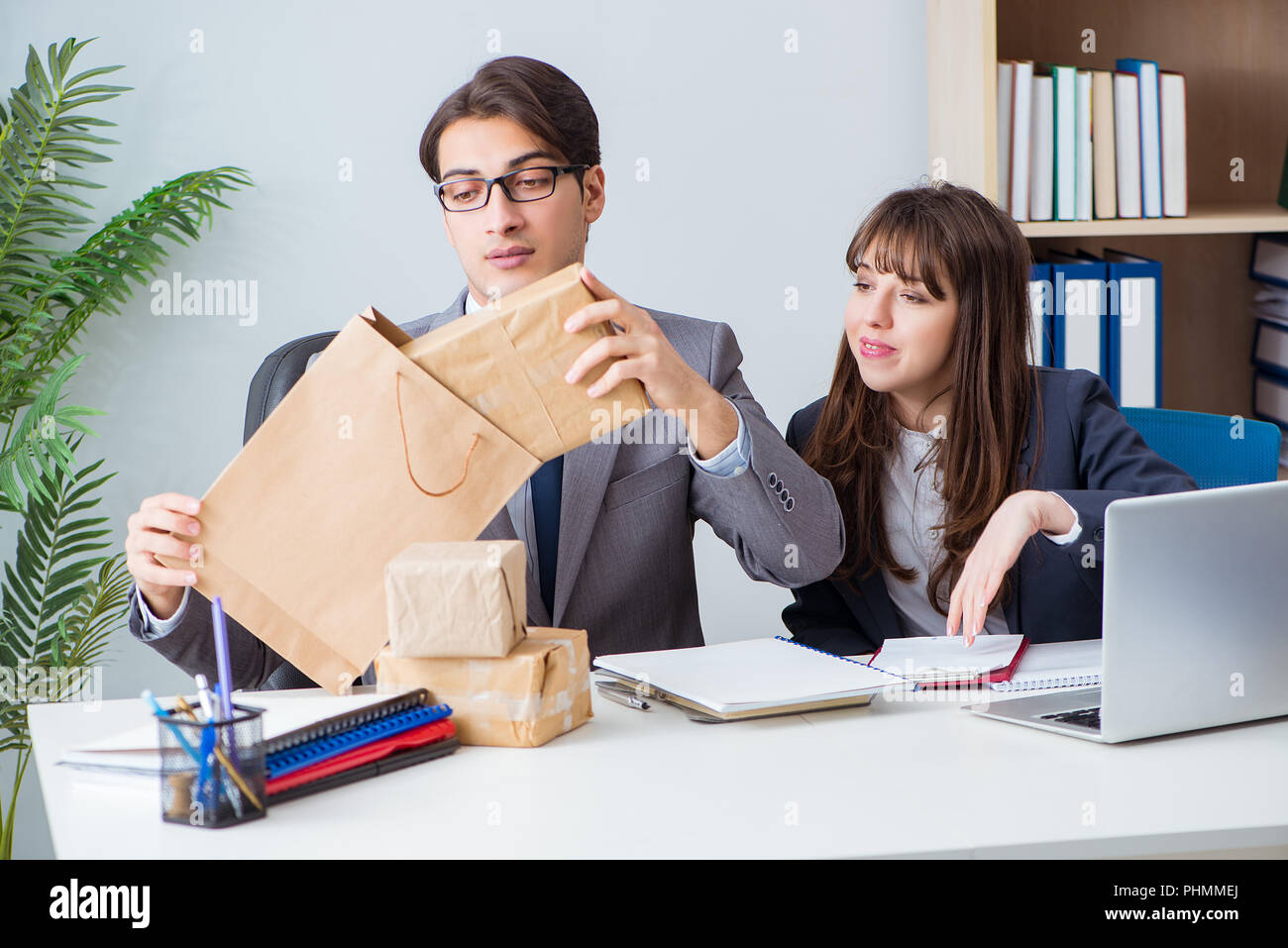 Business people receiving new mail and parcels Stock Photo - Alamy