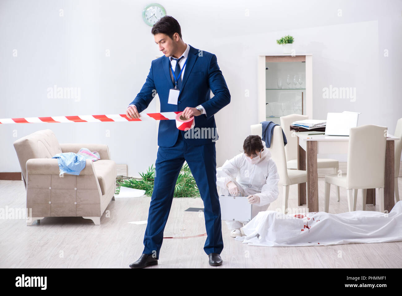 Forensics investigator at the scene of office crime Stock Photo - Alamy