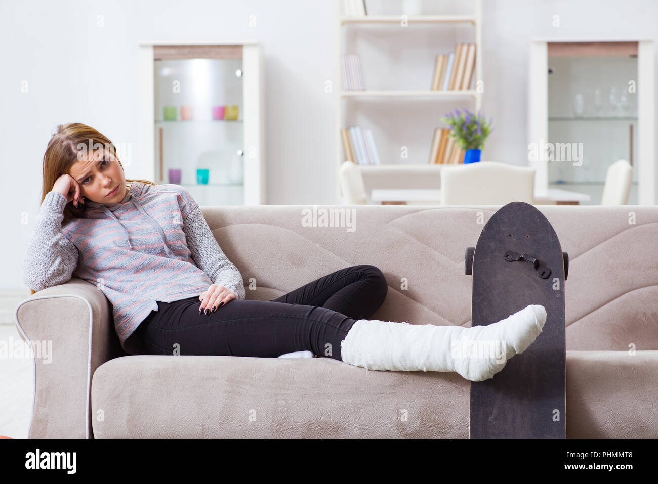 Young woman with broken leg at home Stock Photo - Alamy