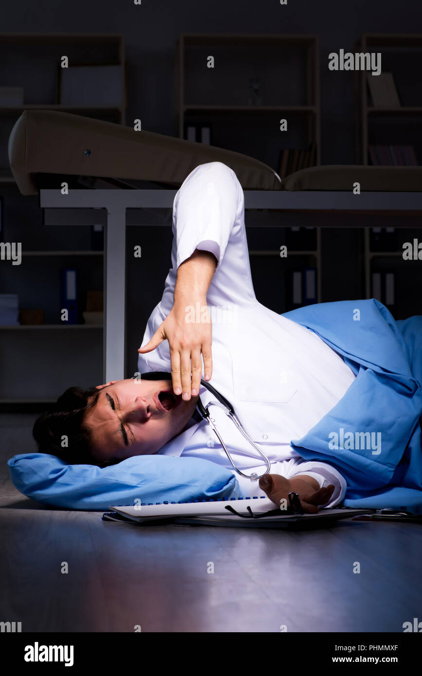 Doctor working night shift in hospital after long hours Stock Photo - Alamy