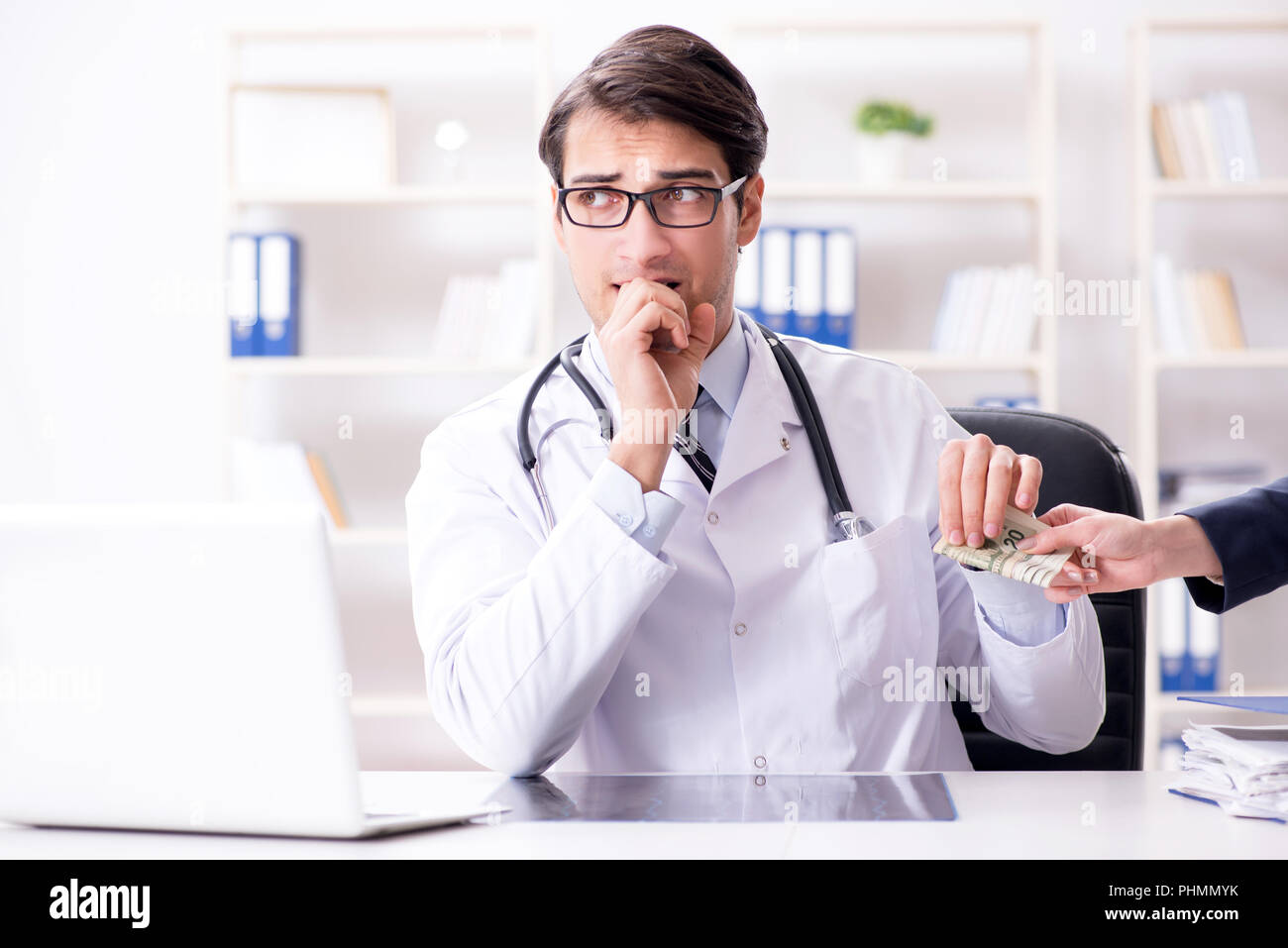 Corrupt doctor taking bribe hi-res stock photography and images - Alamy