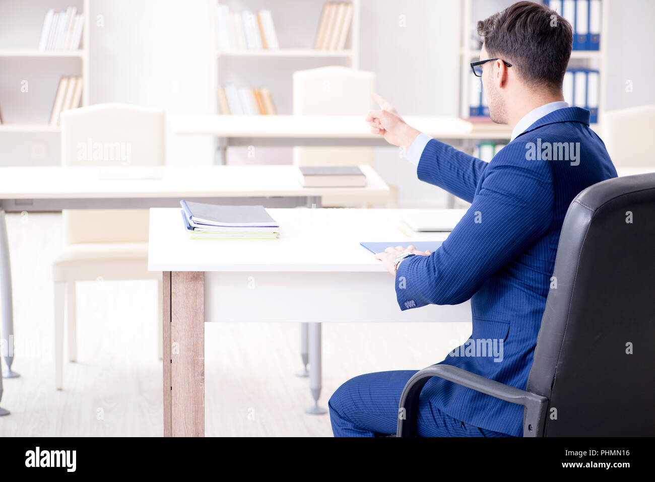 Young handsome businessman employee working in office at desk Stock ...