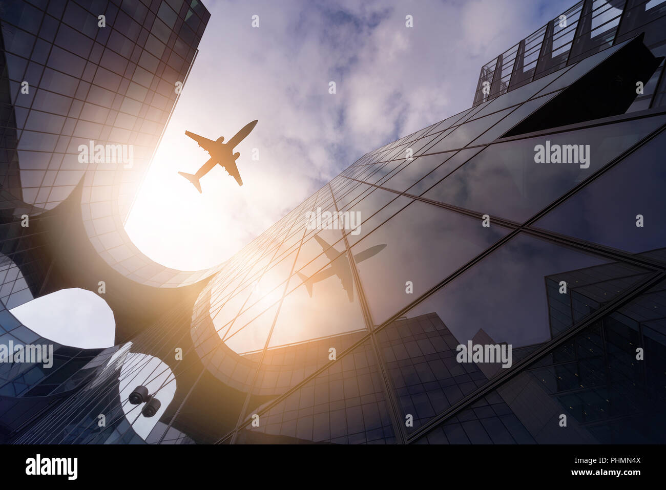 plane over highrise buildings Stock Photo - Alamy