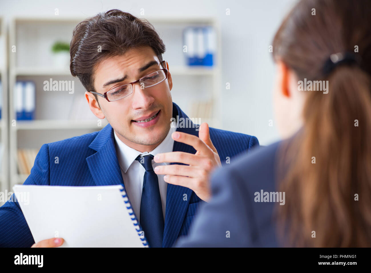 Lawyer talking to his client in office Stock Photo - Alamy