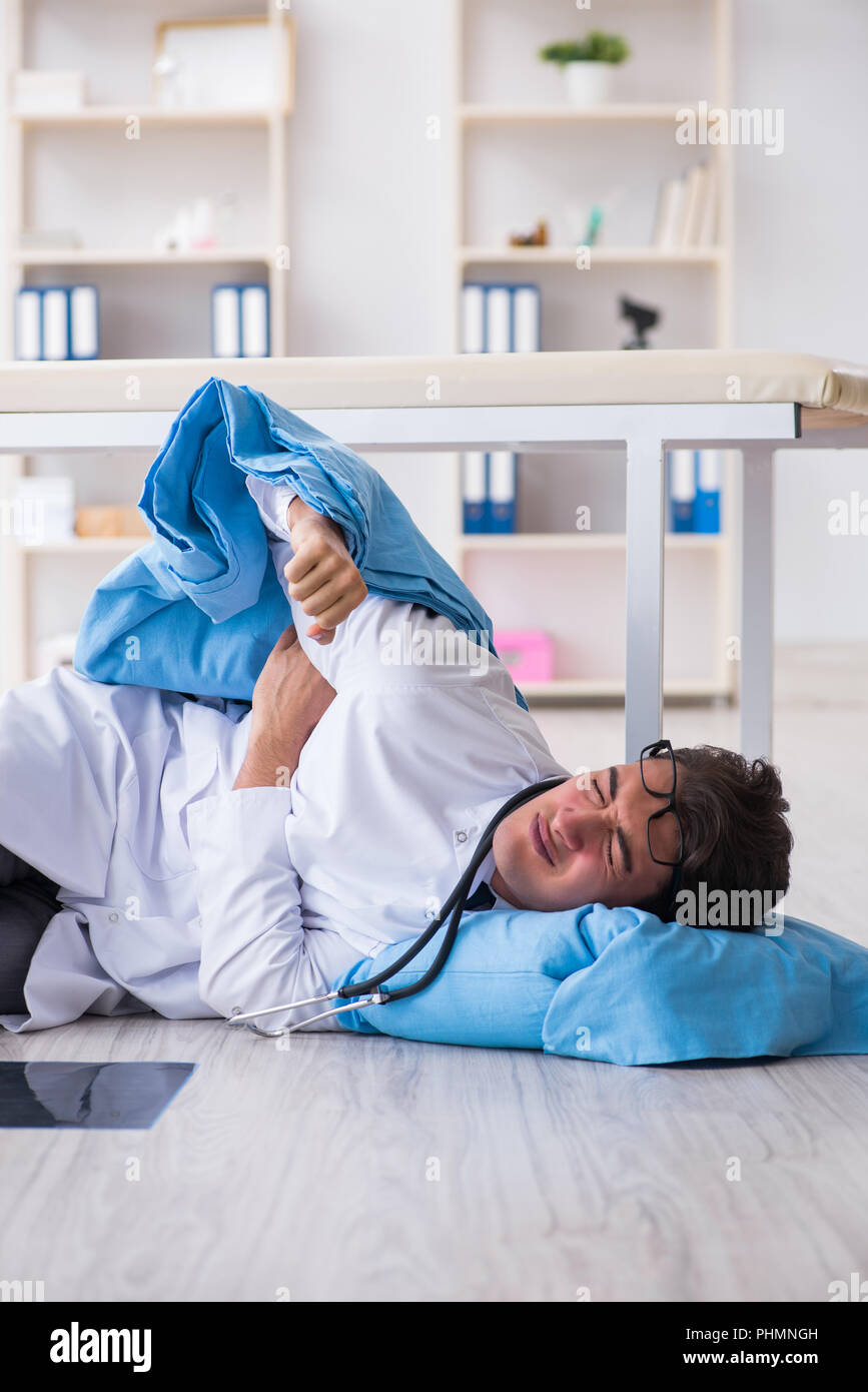 Doctor sleeping on floor after long night shift Stock Photo - Alamy