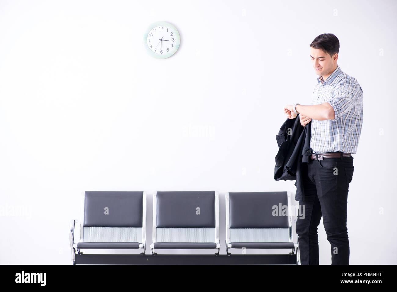 Man nervously impatiently waiting in the lobby Stock Photo - Alamy