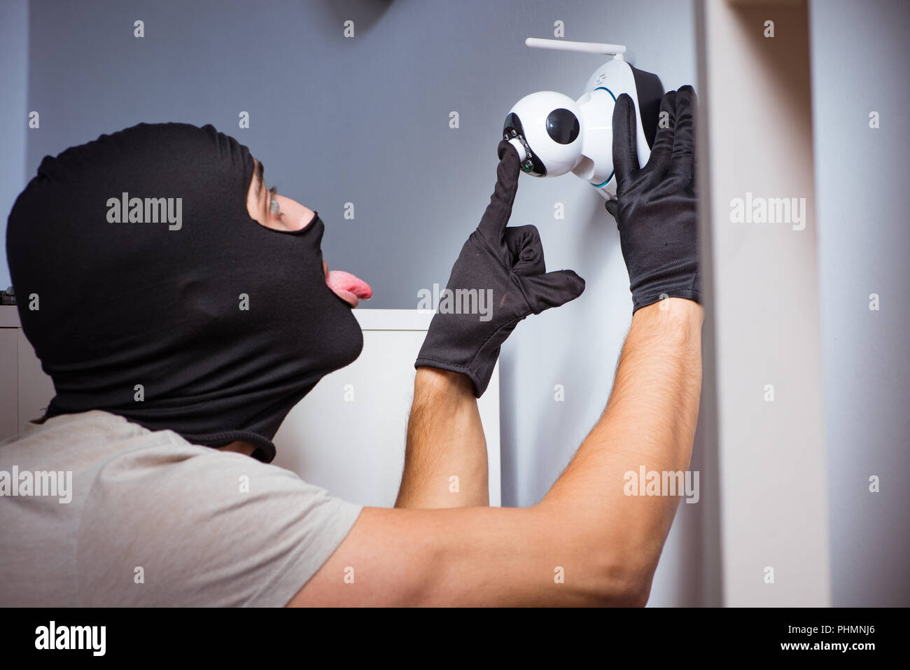 Burglar wearing balaclava mask at crime scene Stock Photo - Alamy
