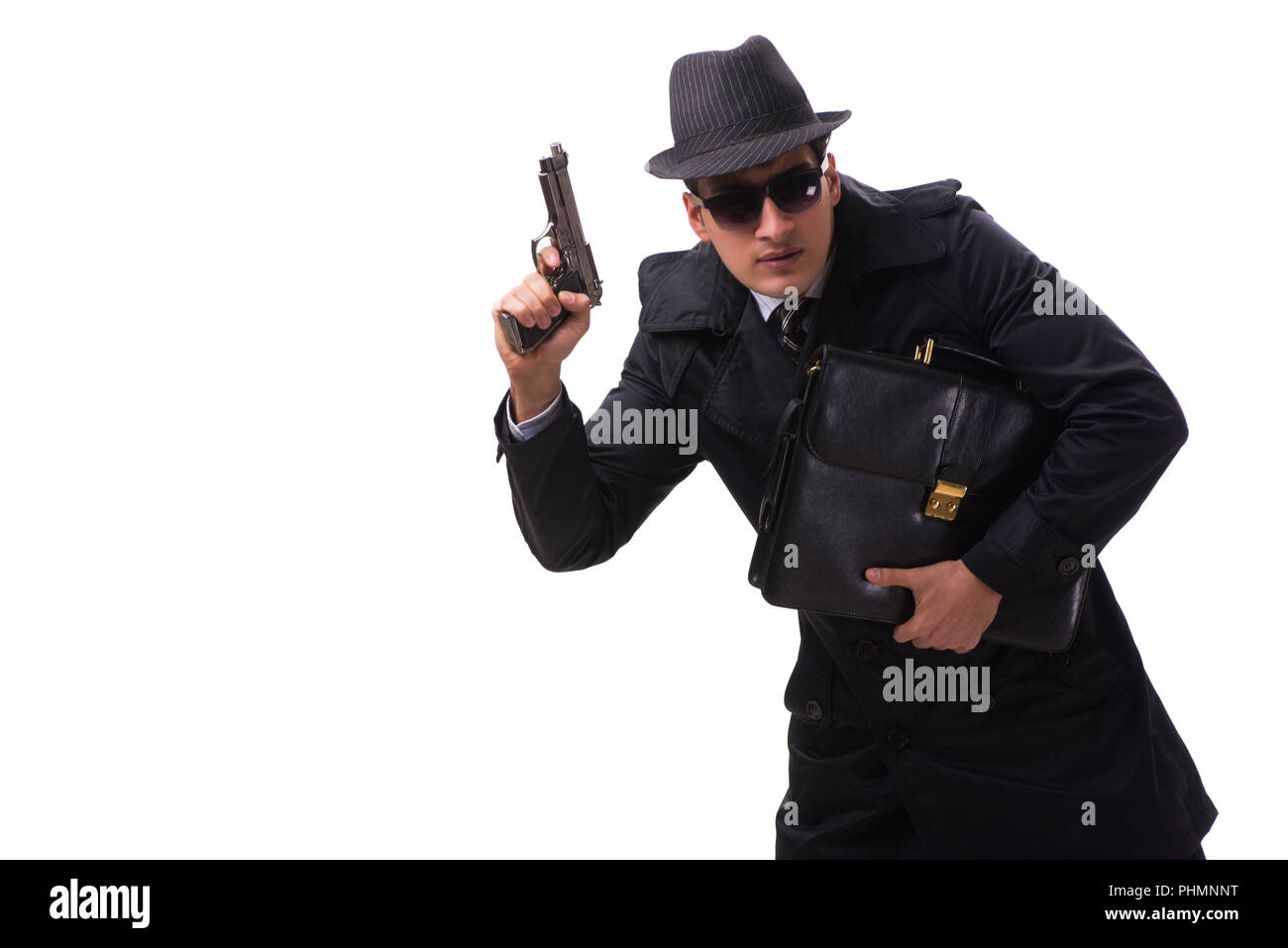 Man spy with handgun isolated on white background Stock Photo - Alamy