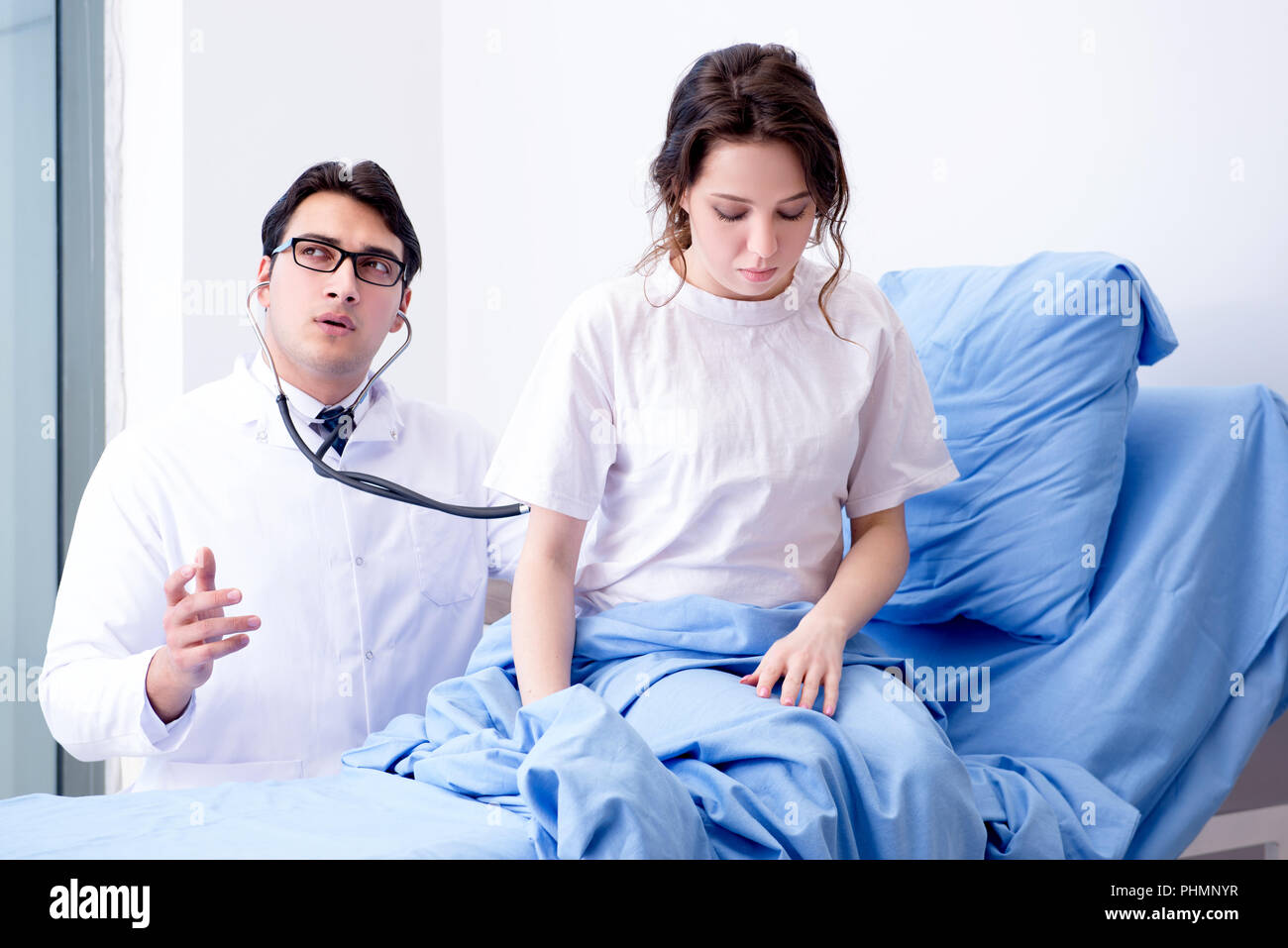Doctor visiting patient in hospital room Stock Photo - Alamy