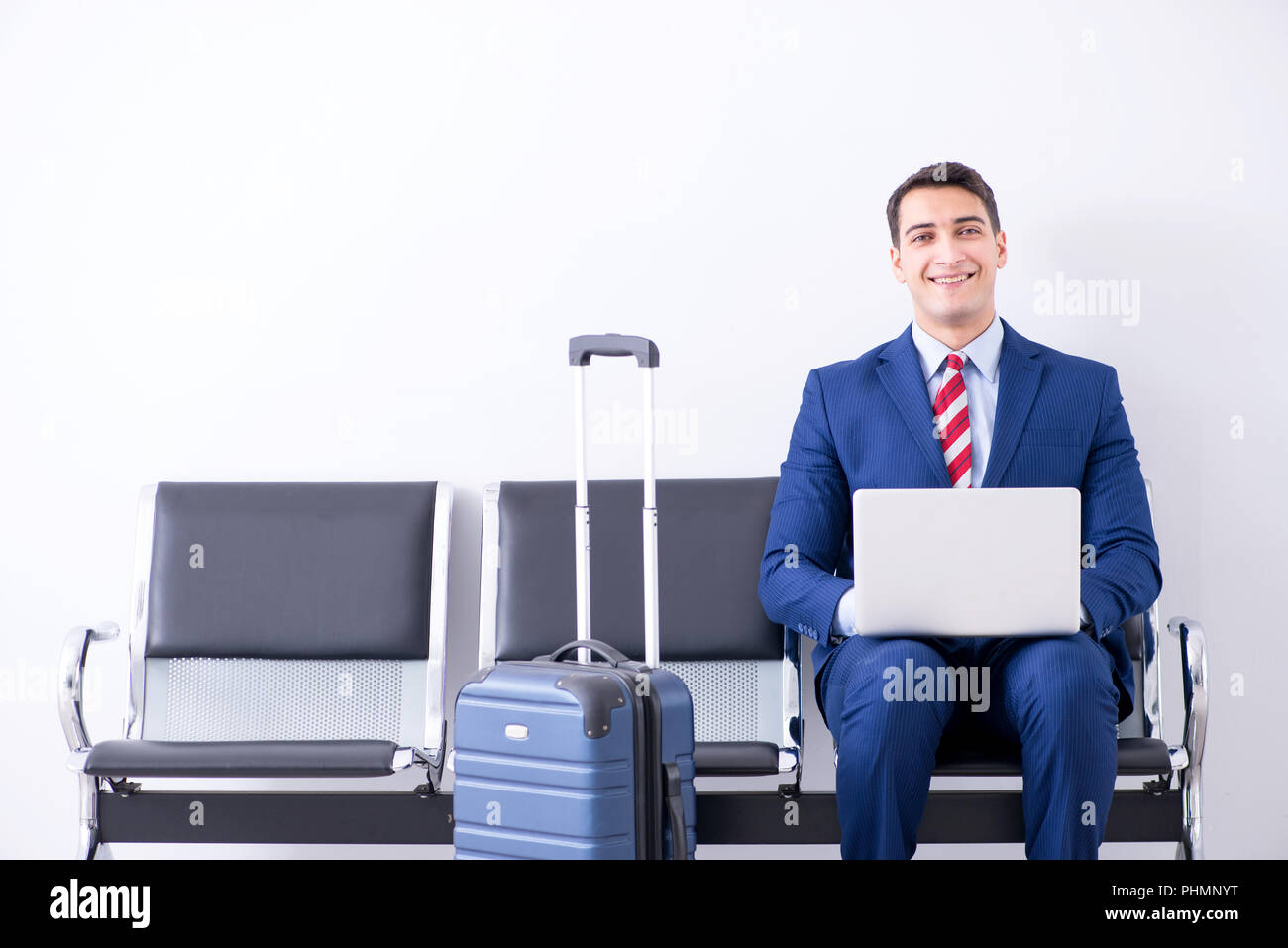 Man wairing to boarding in airport lounge room Stock Photo - Alamy