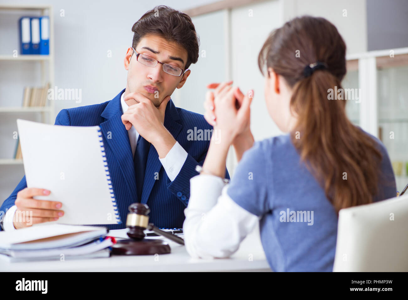 Lawyer talking to his client in office Stock Photo - Alamy