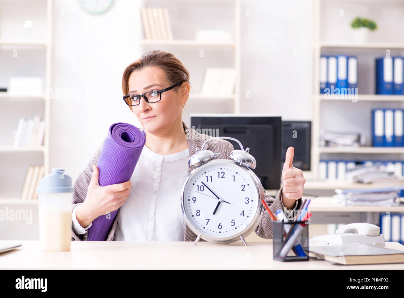 Woman employee going to sports from work during lunch break Stock Photo ...