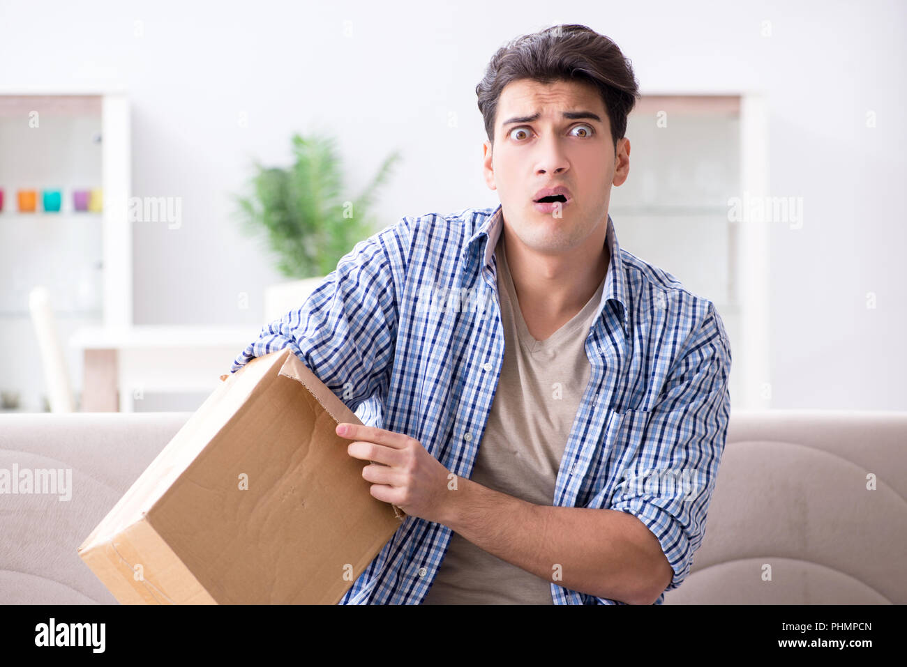 Man receiving empty parcel with stolen goods Stock Photo - Alamy
