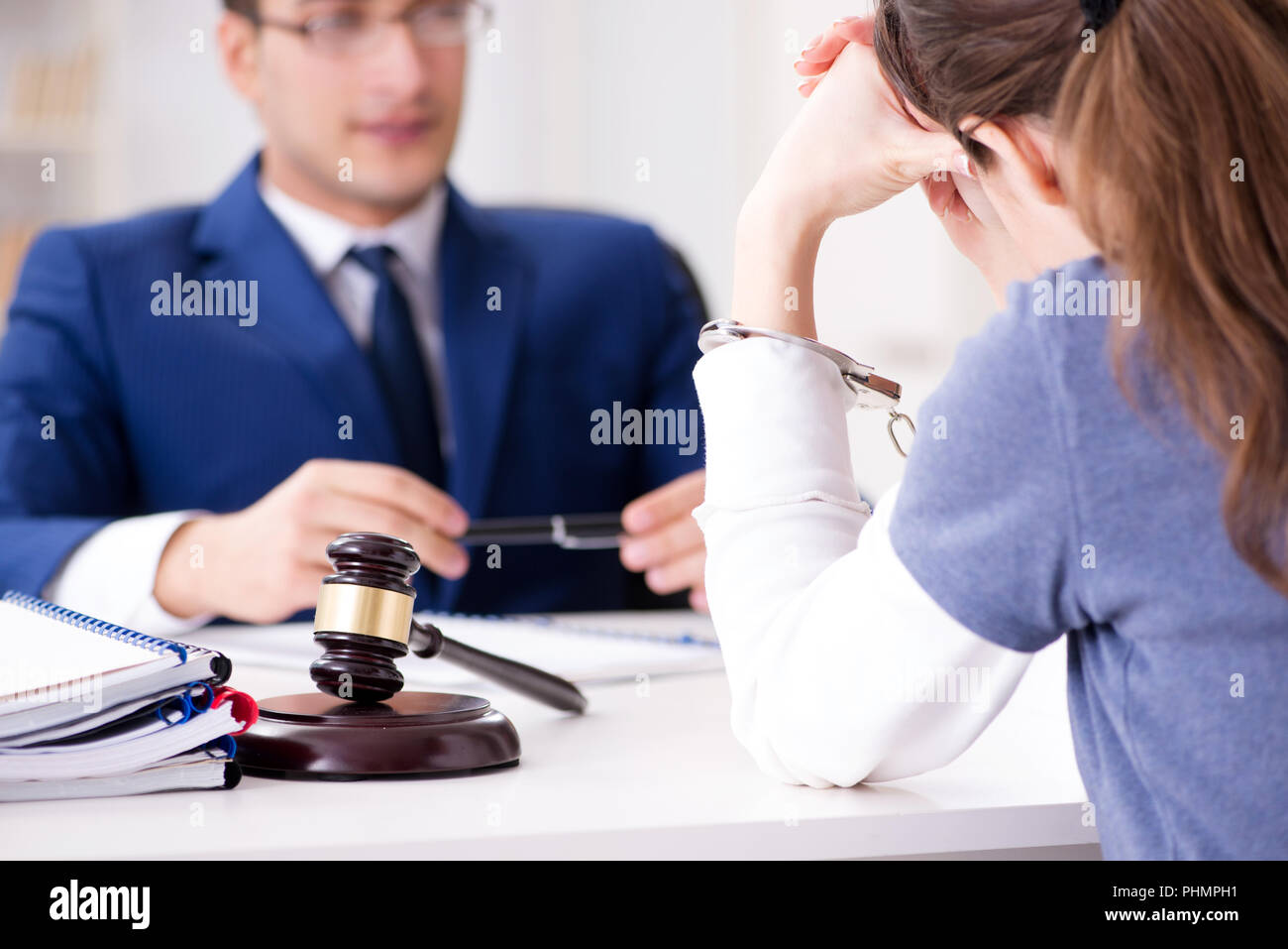 Lawyer talking to his client in office Stock Photo - Alamy