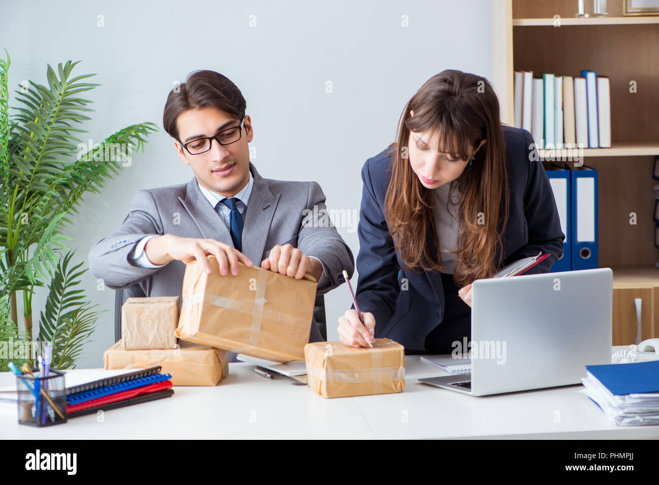 Business people receiving new mail and parcels Stock Photo - Alamy