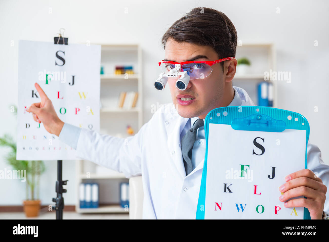 Eye doctor in eyecare concept in hospital Stock Photo - Alamy