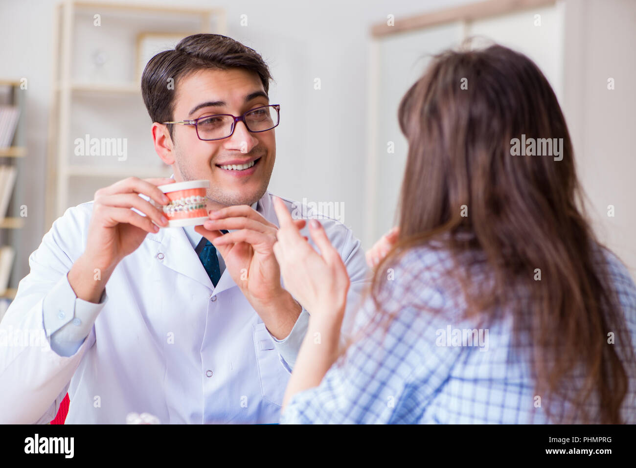 Patient visiting dentist doctor for preliminary appointment Stock Photo ...