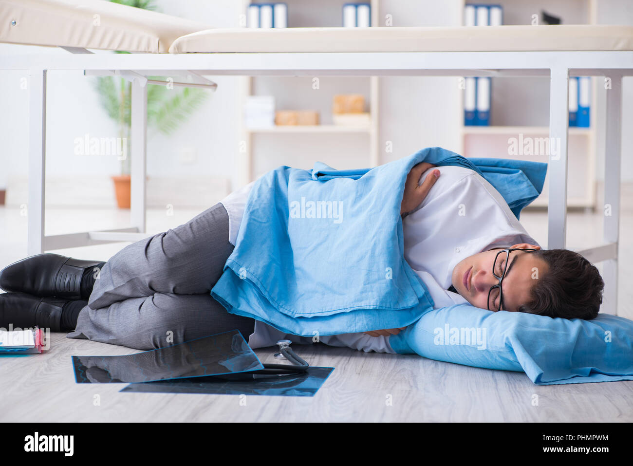 Doctor sleeping on floor after long night shift Stock Photo - Alamy