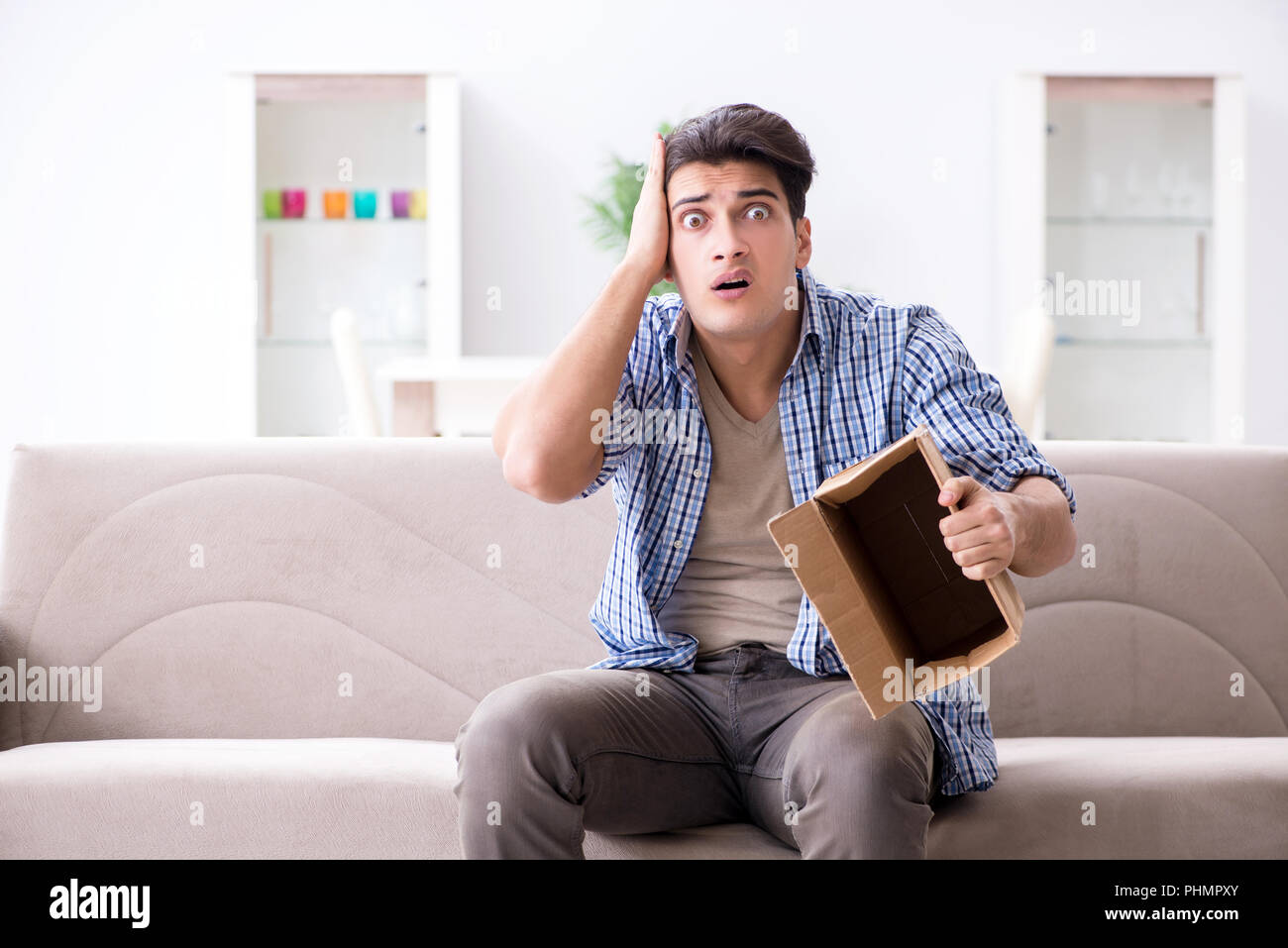 Man receiving empty parcel with stolen goods Stock Photo - Alamy