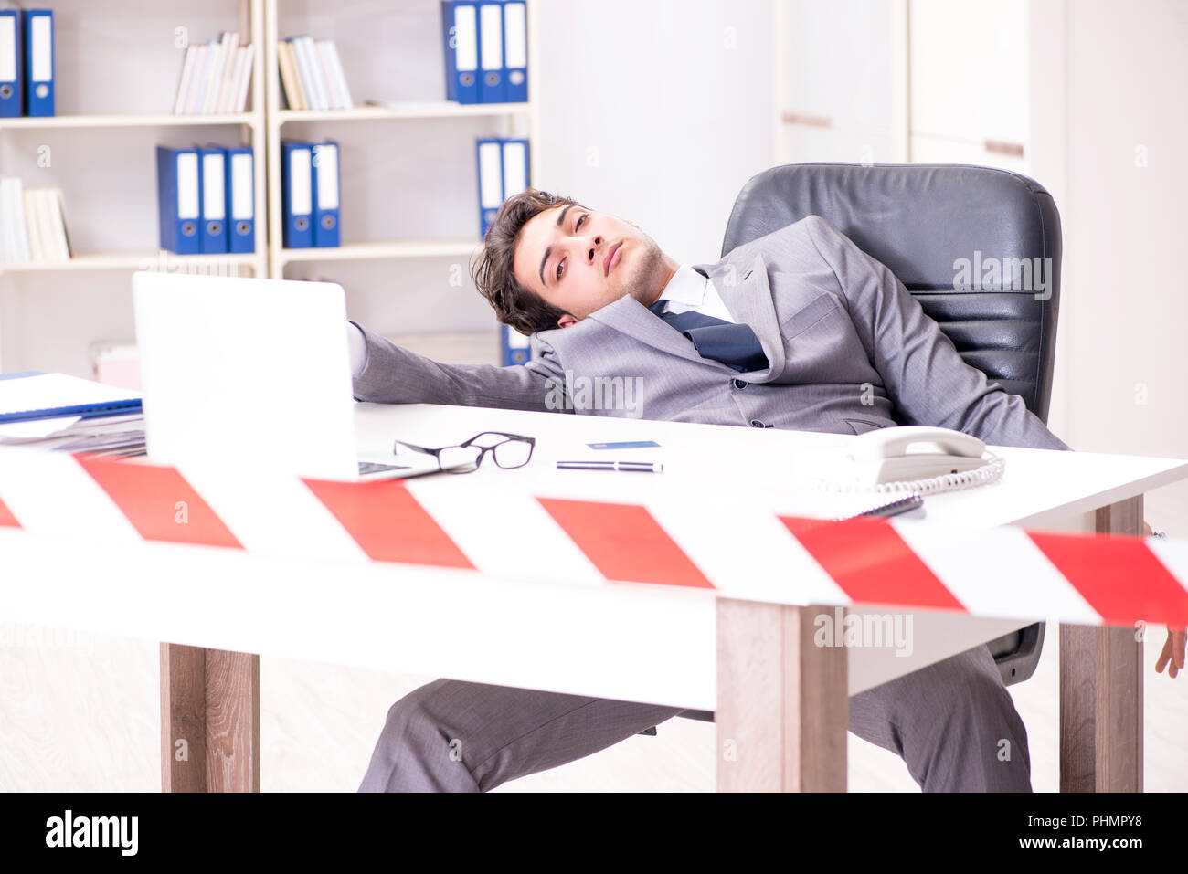 Dead businessman at this desk Stock Photo - Alamy