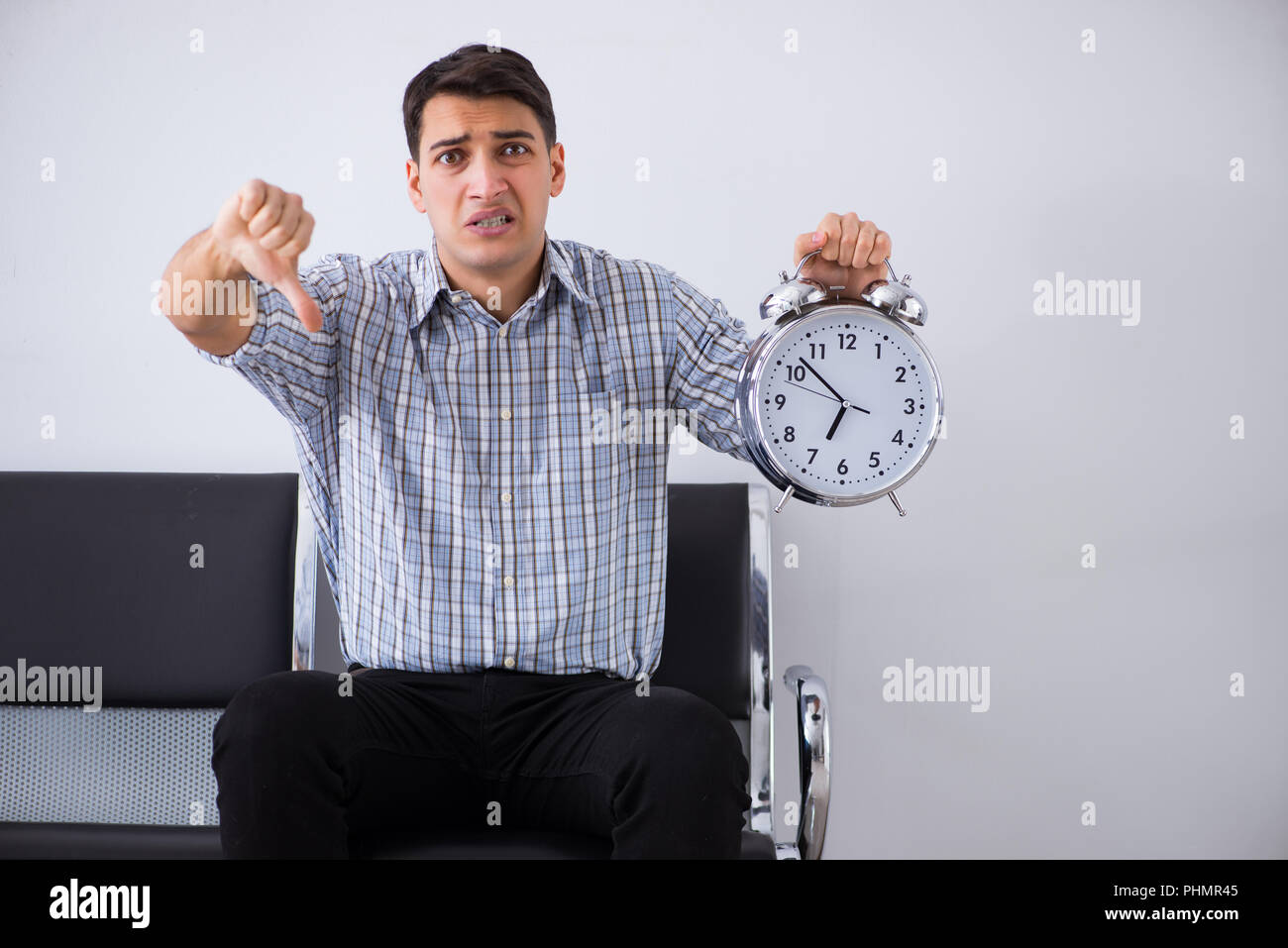 Frustrated businessman waiting in airport hi-res stock photography and ...