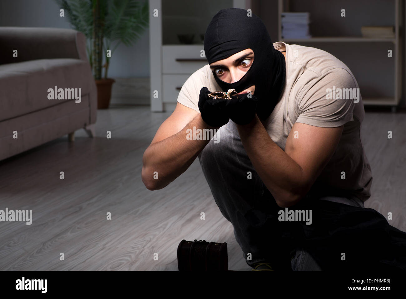 Burglar wearing balaclava mask at crime scene Stock Photo - Alamy