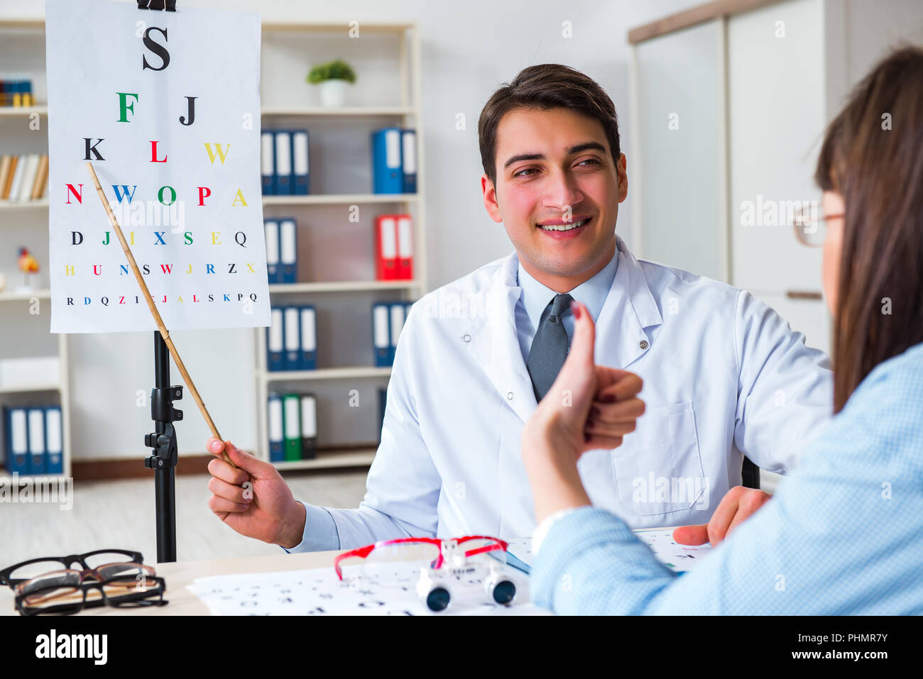 Doctor with patient at eye exam Stock Photo - Alamy