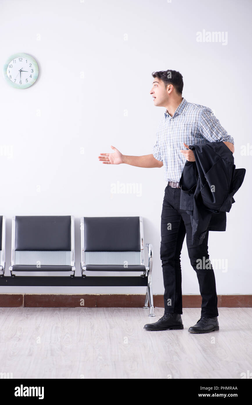 Man nervously impatiently waiting in the lobby Stock Photo - Alamy