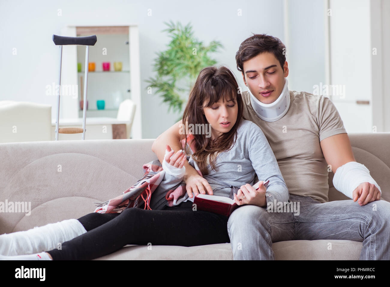 Injured family of wife and husband recovering at home Stock Photo - Alamy